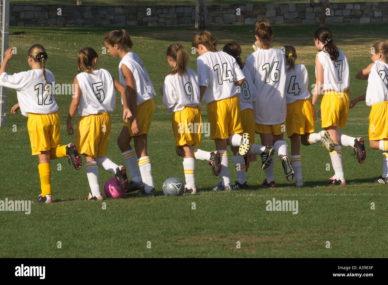 girl soccer team stretching Stock Photo - Alamy