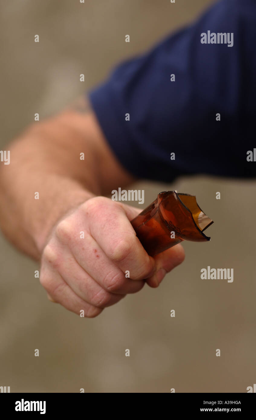Aggressive man with broken beer bottle Stock Photo - Alamy