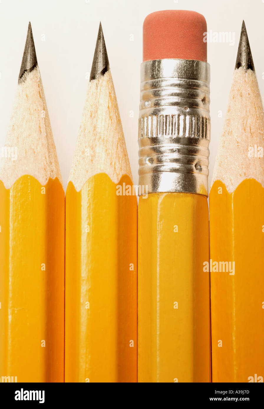 Three sharpened pencils and a pencil eraser Stock Photo - Alamy
