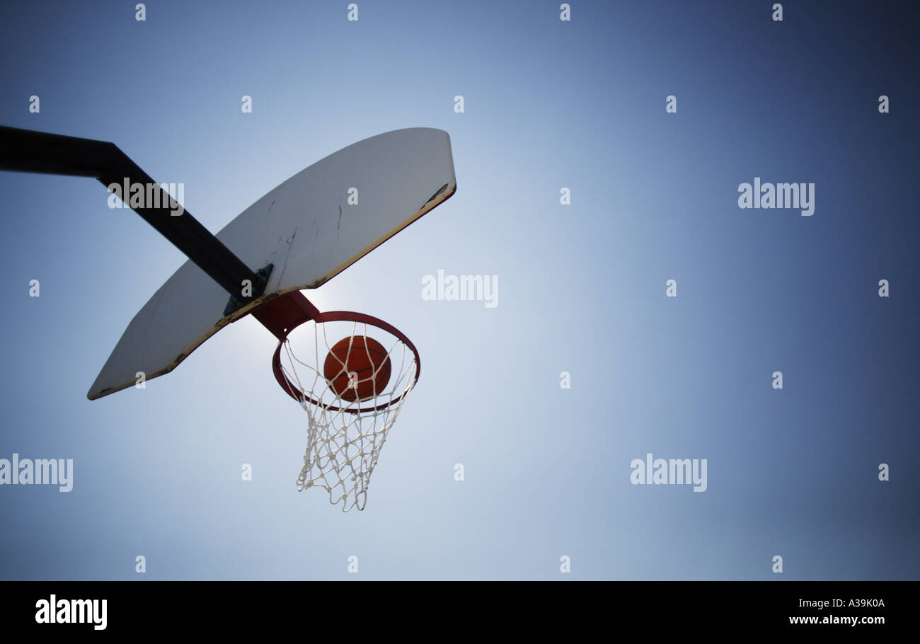 Basketball going through hoop hi-res stock photography and images - Alamy