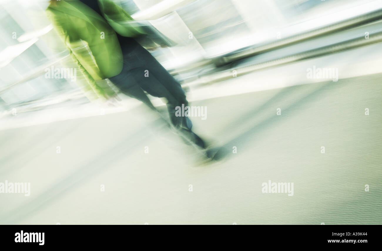 Person walking down hall Stock Photo - Alamy