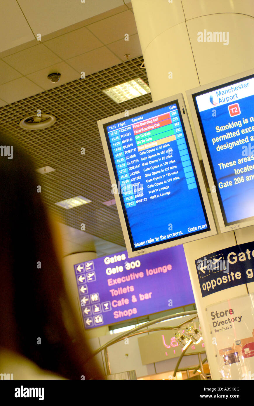 Information TV screens Manchester airport U K Stock Photo - Alamy