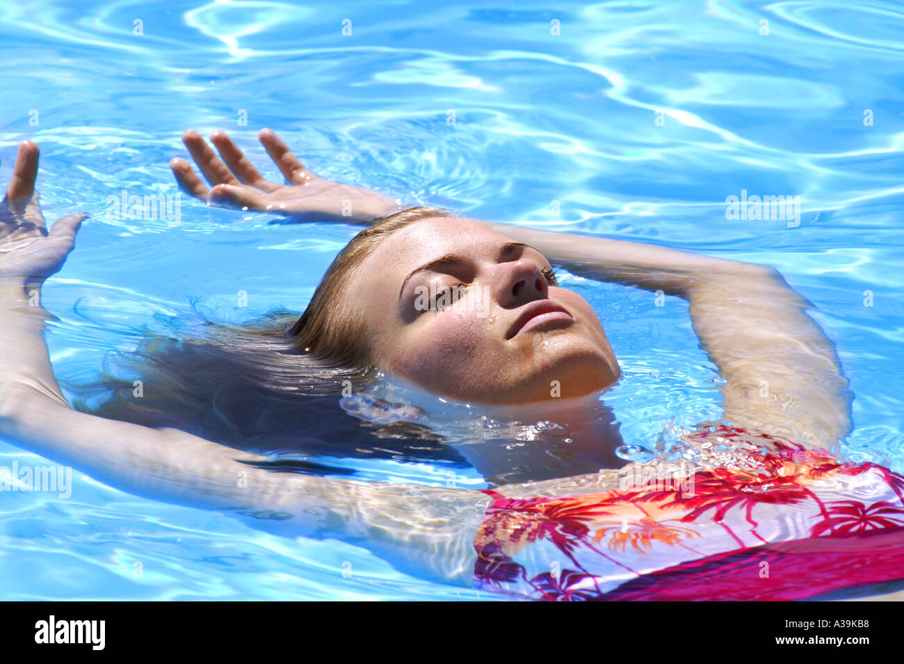 Lady floating in water Stock Photo - Alamy