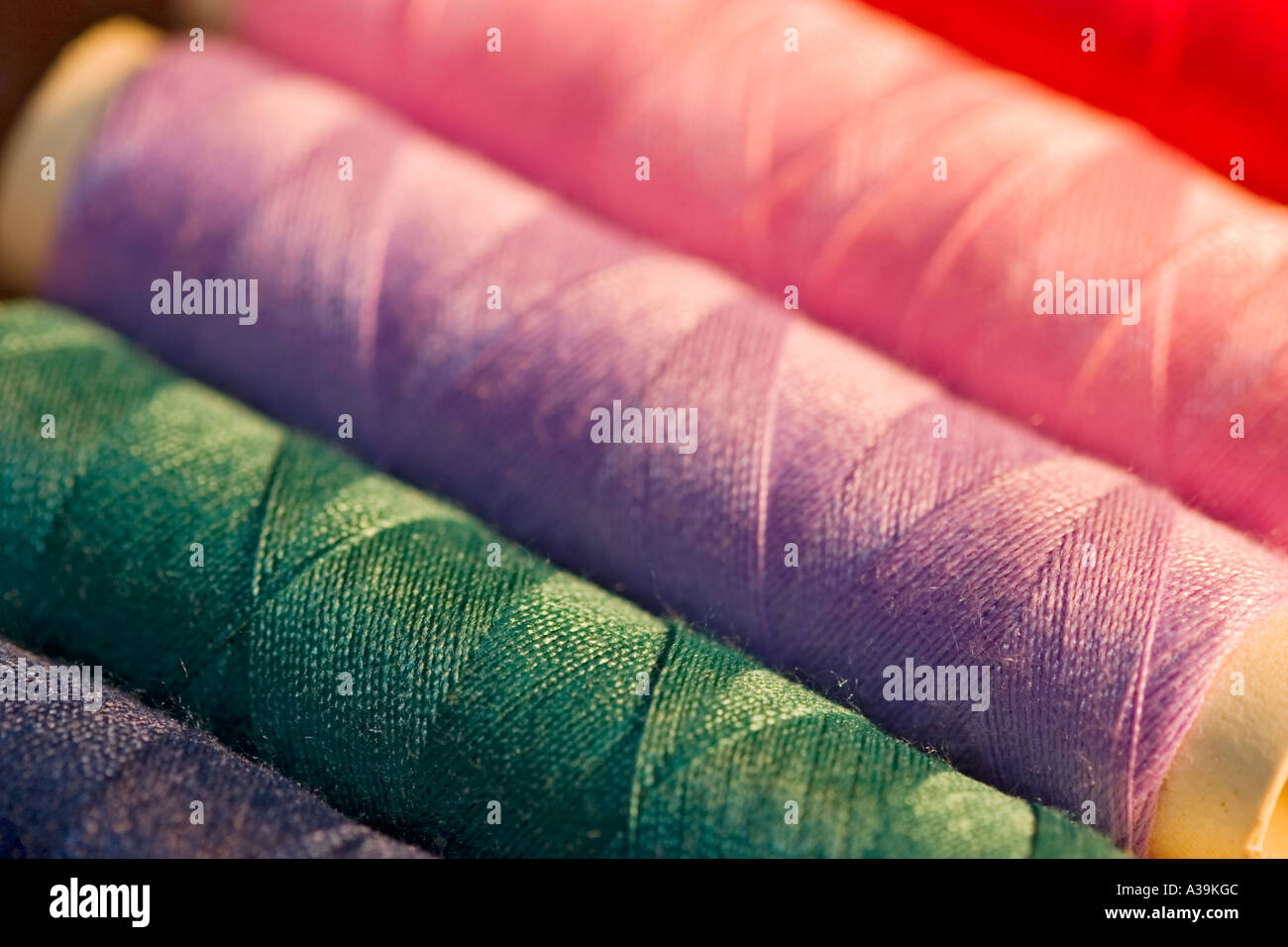 Close up of different coloured sewing threads on leather Stock Photo ...