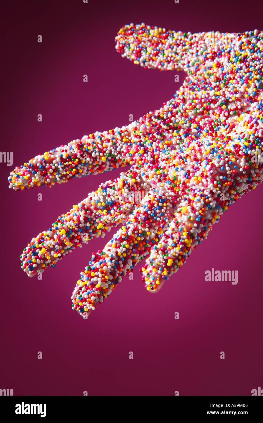 Sprinkle covered hand Stock Photo - Alamy