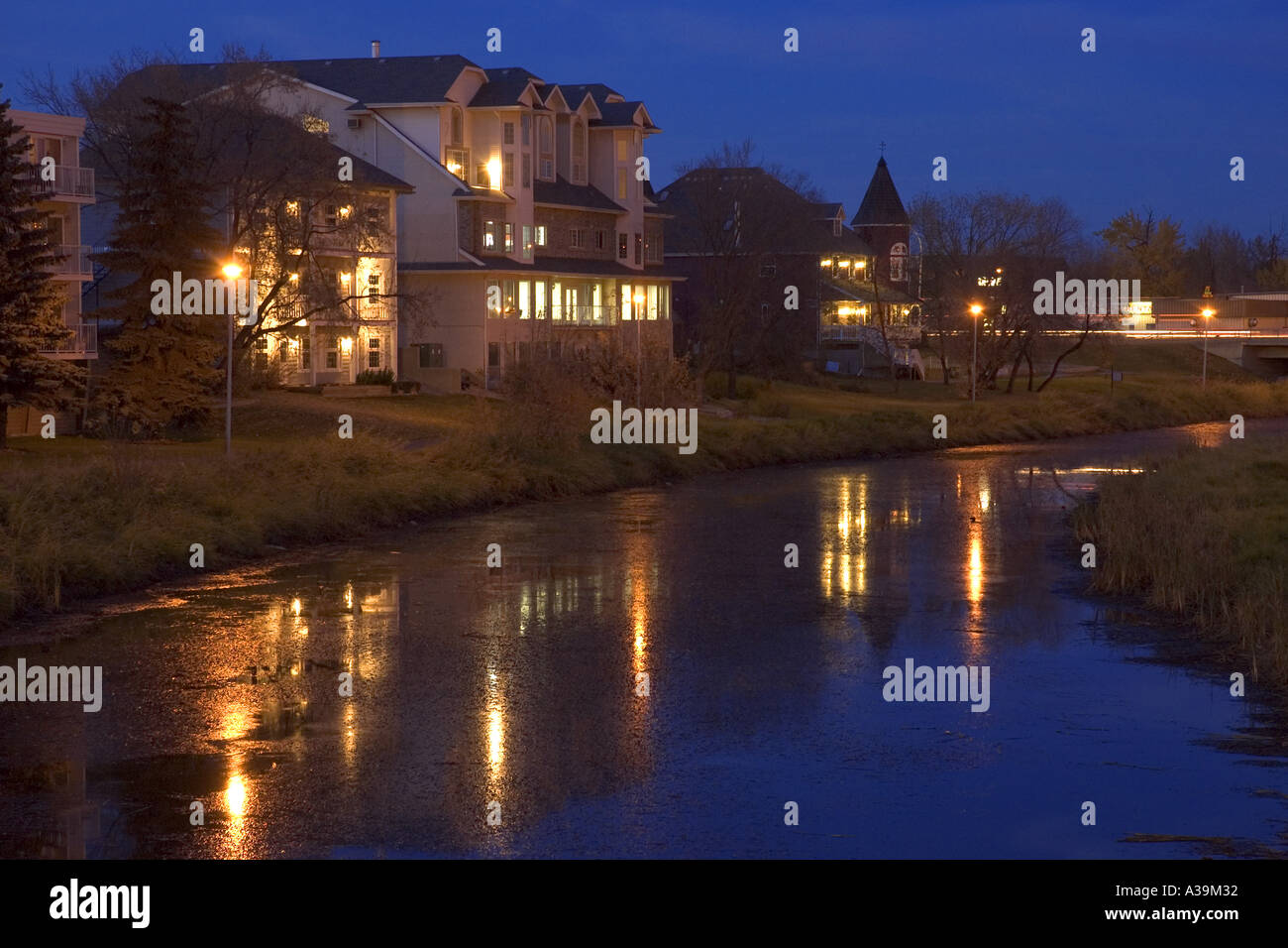 Riverside buildings at night Stock Photo - Alamy