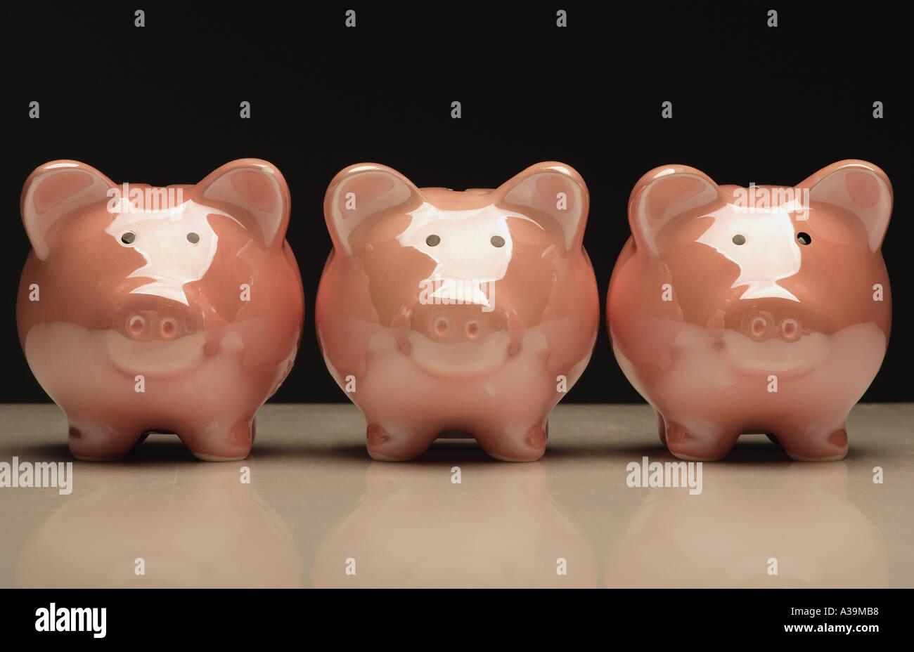 Three pottery pigs Stock Photo - Alamy