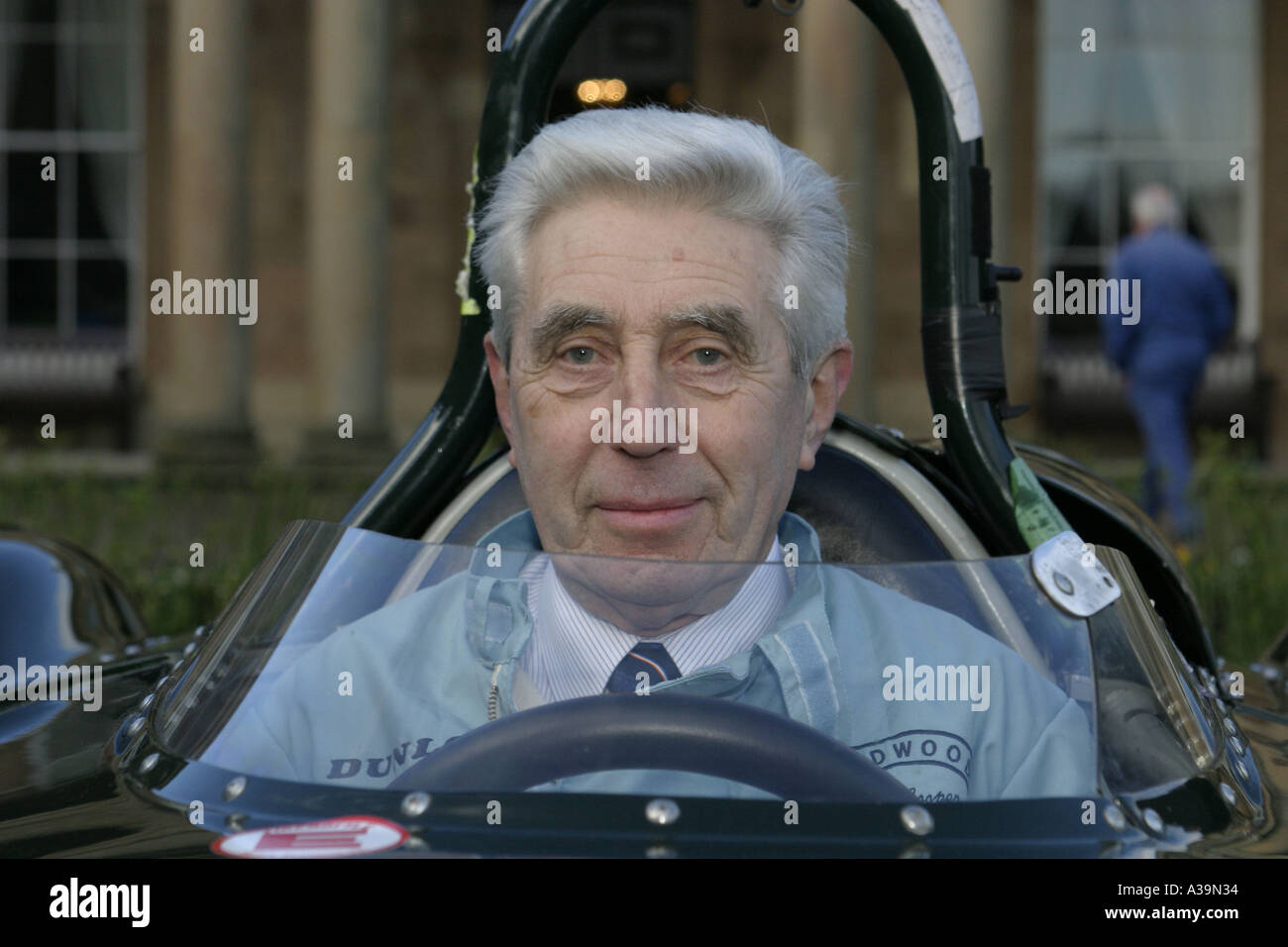 George Cooper sitting in his 1955 Cooper Coventry Climax outside ...