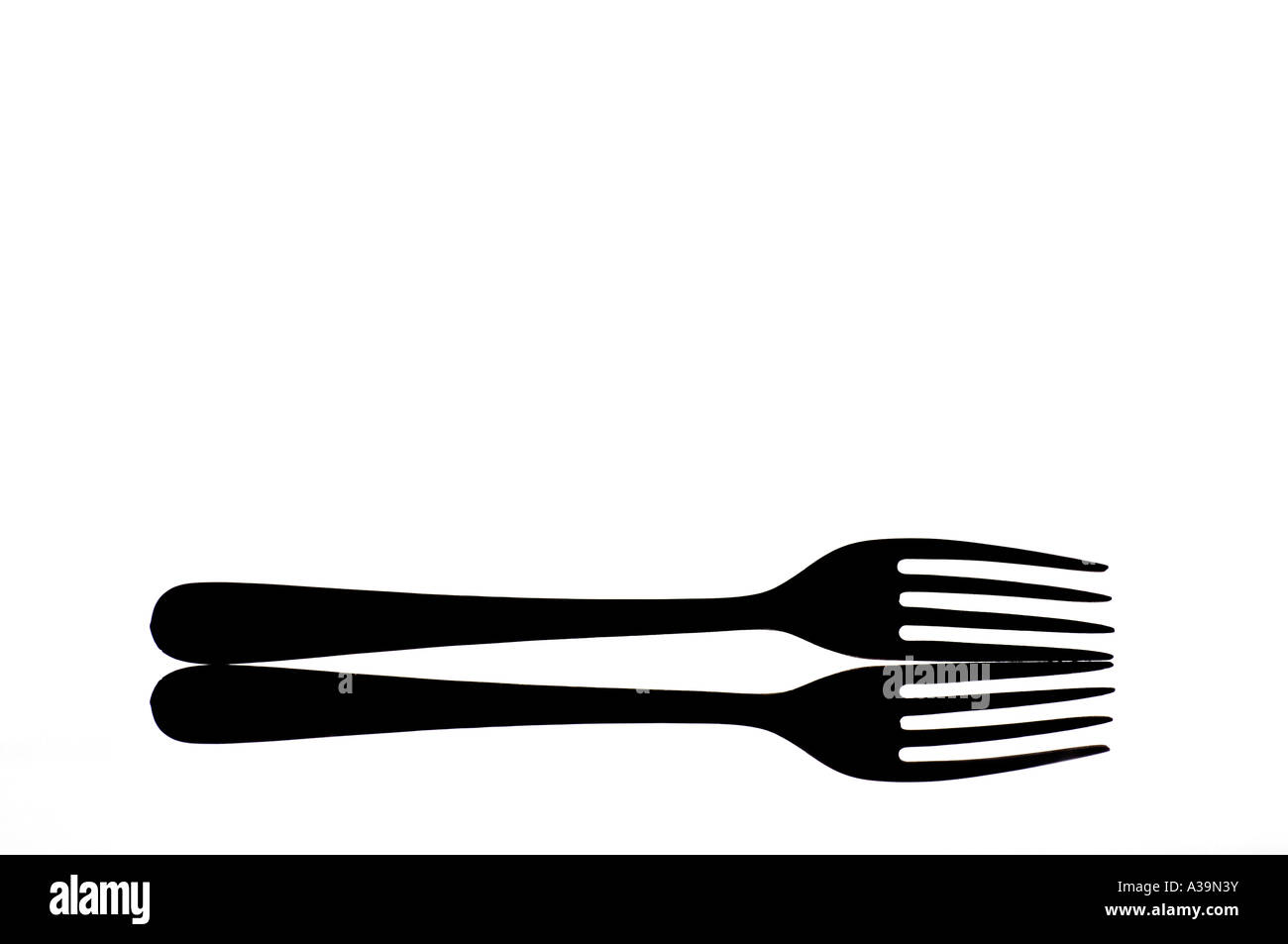 Silhouette of a fork with reflection on a white background Stock Photo ...