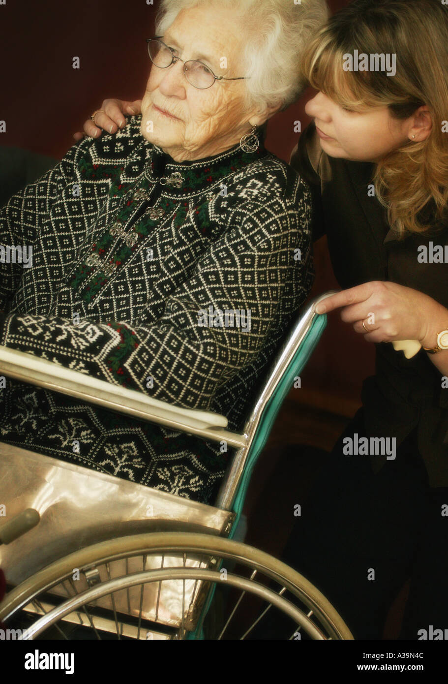 Senior woman comforted by adult hi-res stock photography and images - Alamy