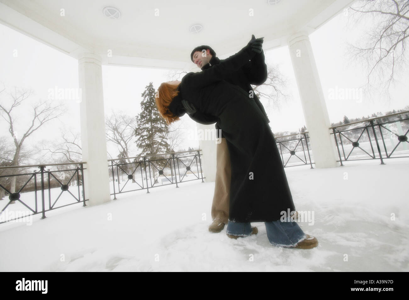 Couple dancing in snow hi-res stock photography and images - Alamy