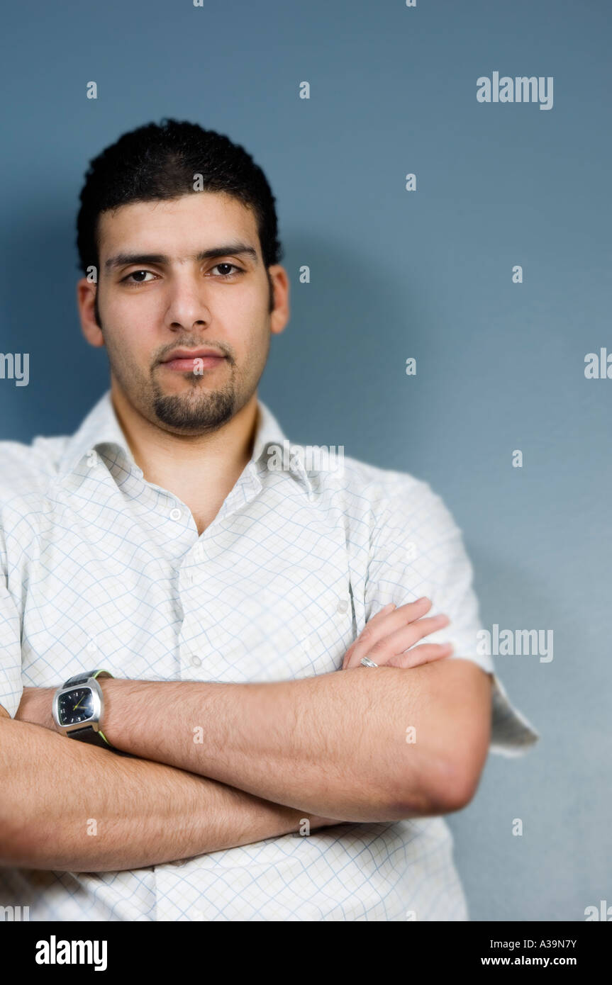 young man hands crossed Stock Photo - Alamy