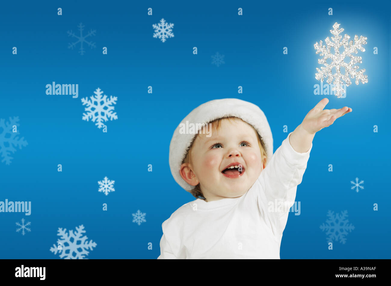 Baby and snowflakes Stock Photo - Alamy