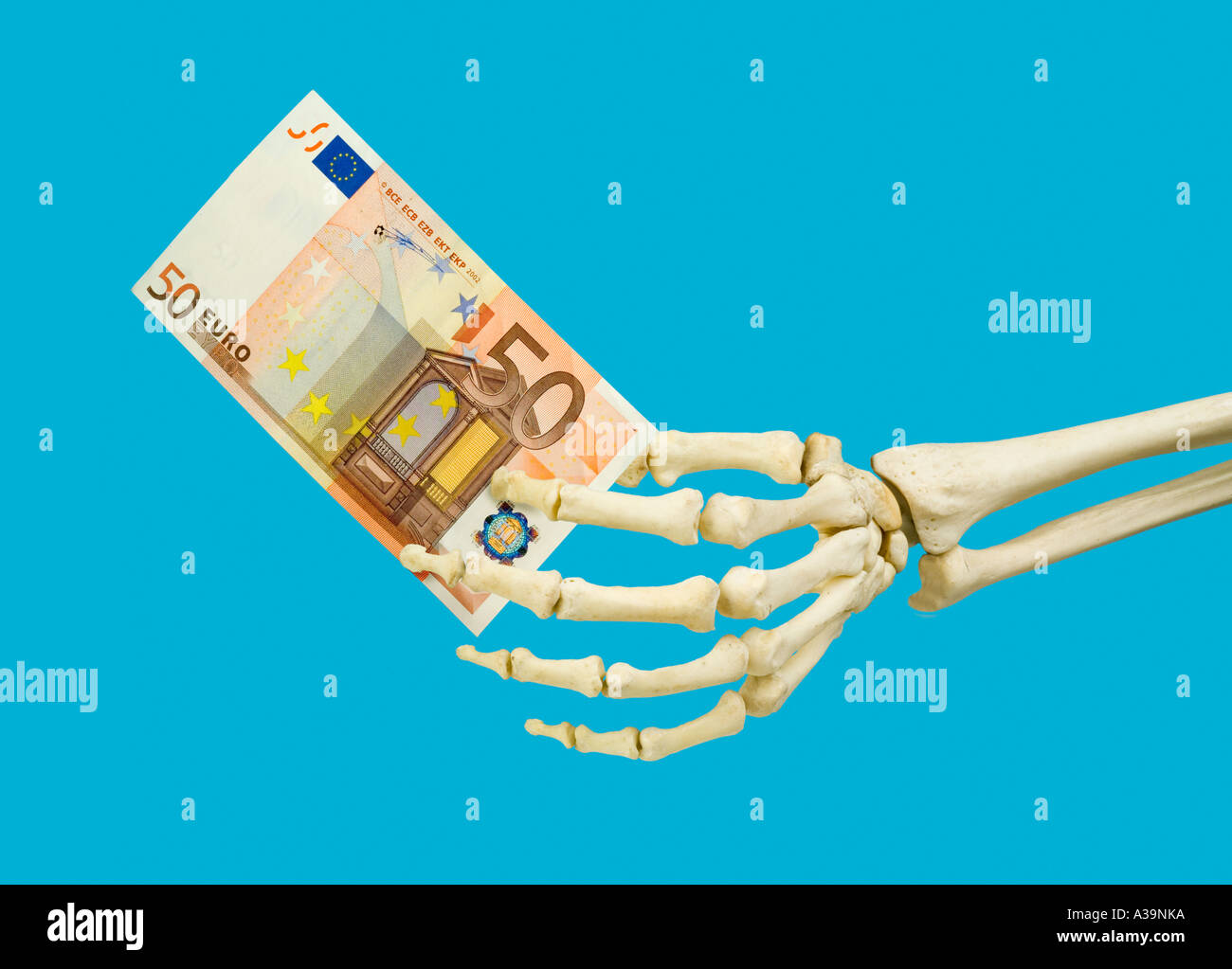 Skeleton hand and uk bank note hi-res stock photography and images - Alamy