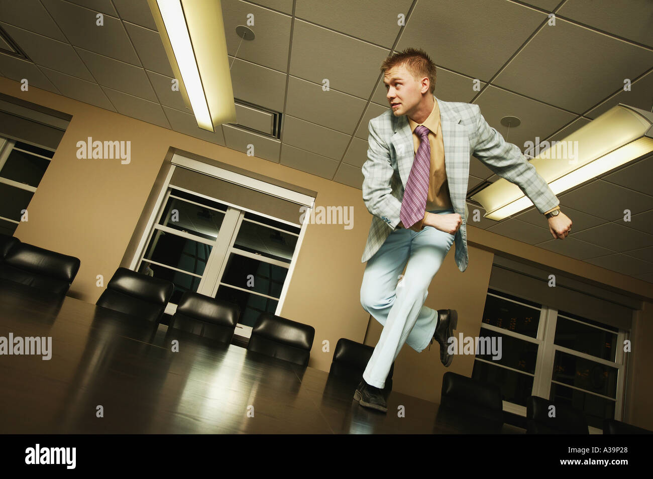 Break Time - dancing on boardroom table Stock Photo - Alamy