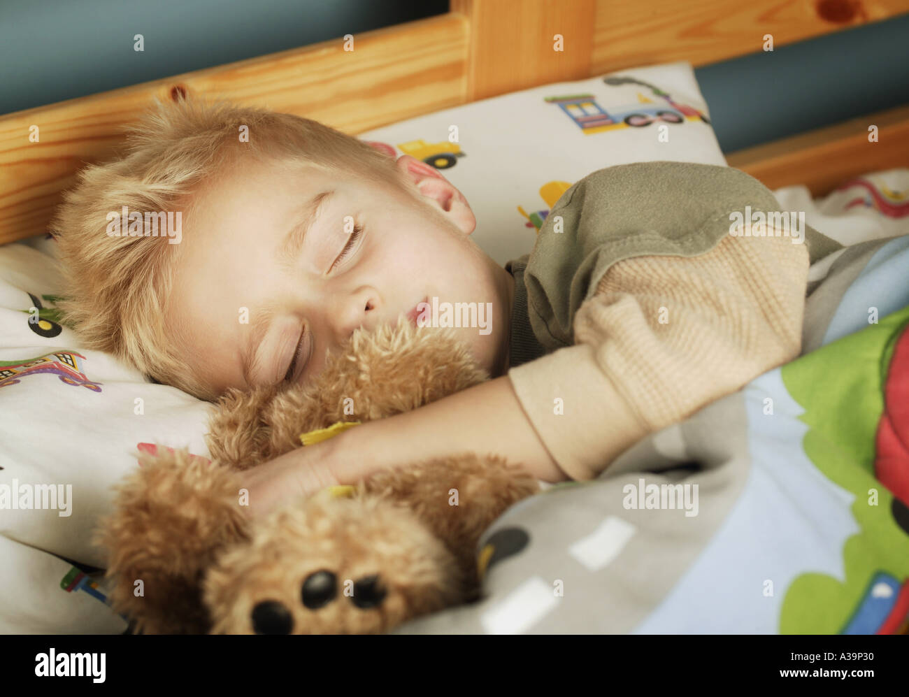 Little boy fast asleep in bed Stock Photo - Alamy
