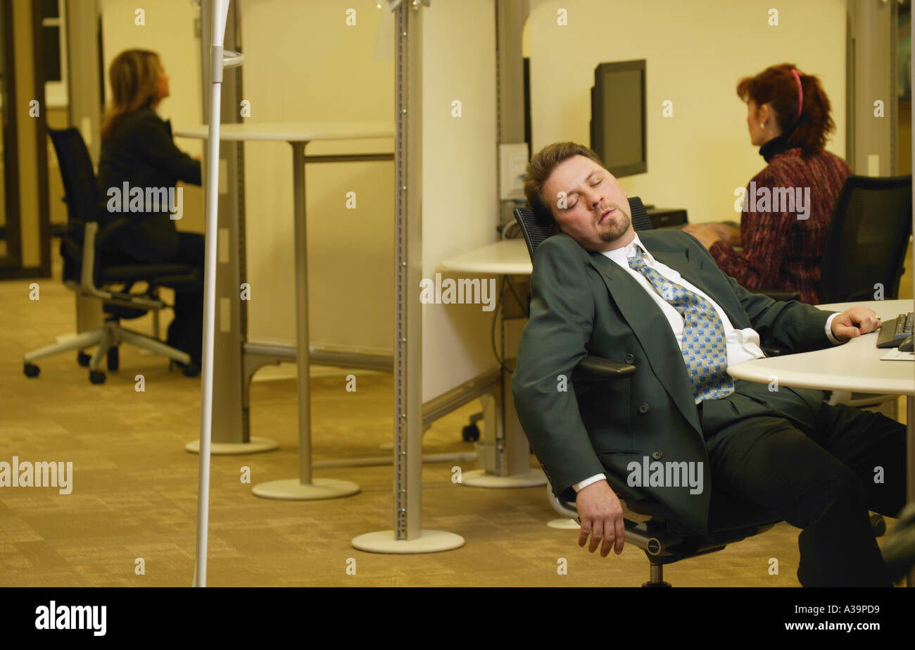 Office worker asleep at his desk Stock Photo - Alamy
