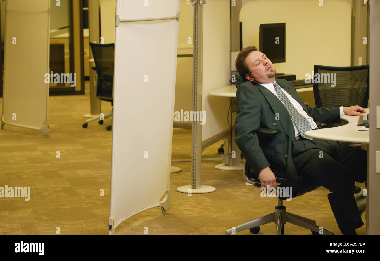 Office worker asleep at his desk Stock Photo - Alamy