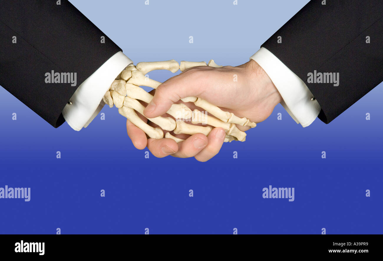 Business man shaking skeletons hand blue Stock Photo - Alamy