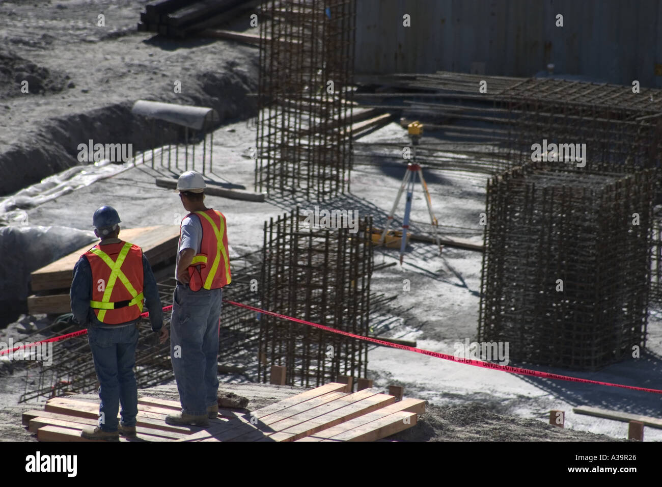 Building site and two construction workers Stock Photo - Alamy