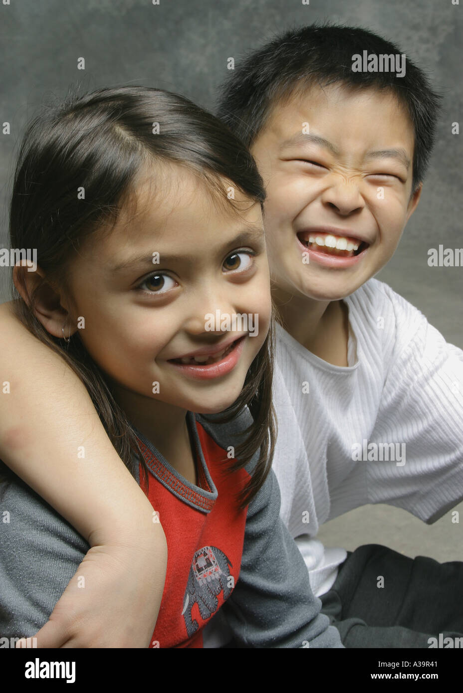 Two children having a giggle Stock Photo - Alamy