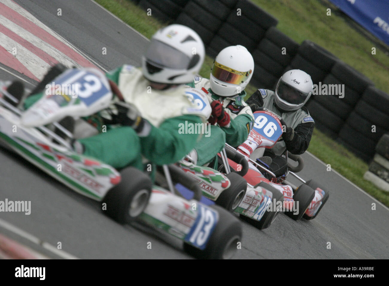 angled three senior rotax max kart drivers coming out of a corner Nutts ...