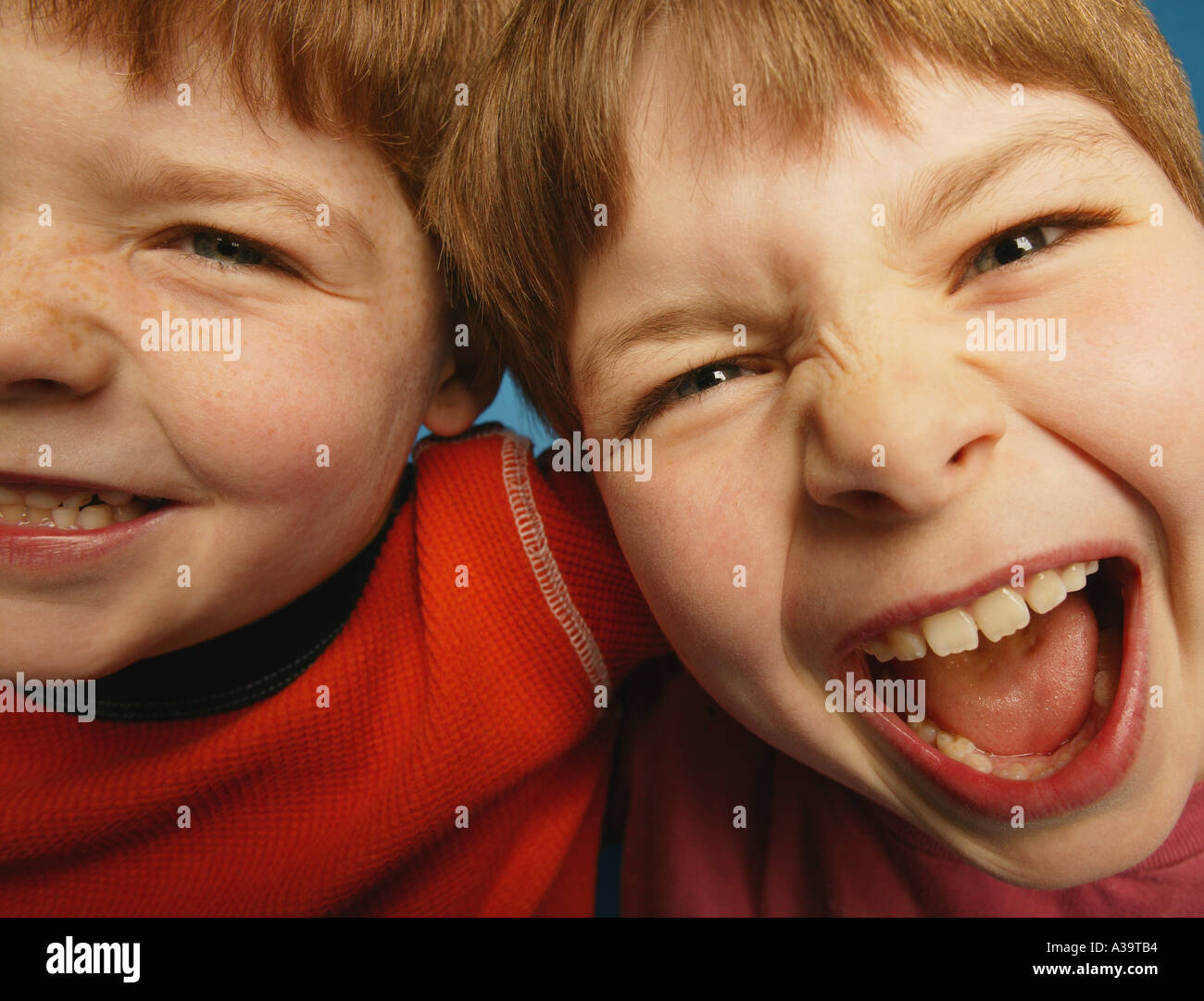 Two noisy young friends Stock Photo - Alamy