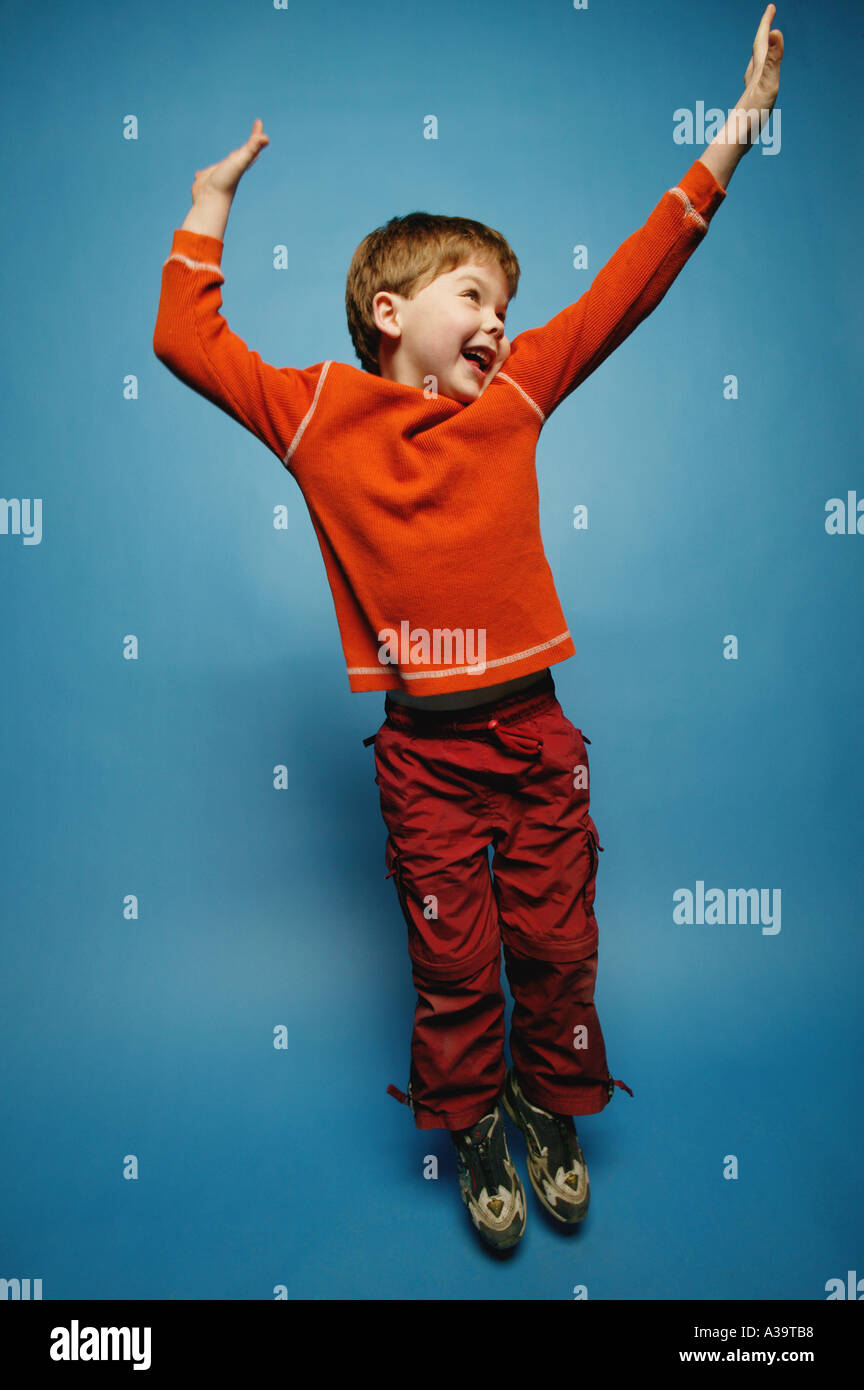 Young boy jumping Stock Photo - Alamy