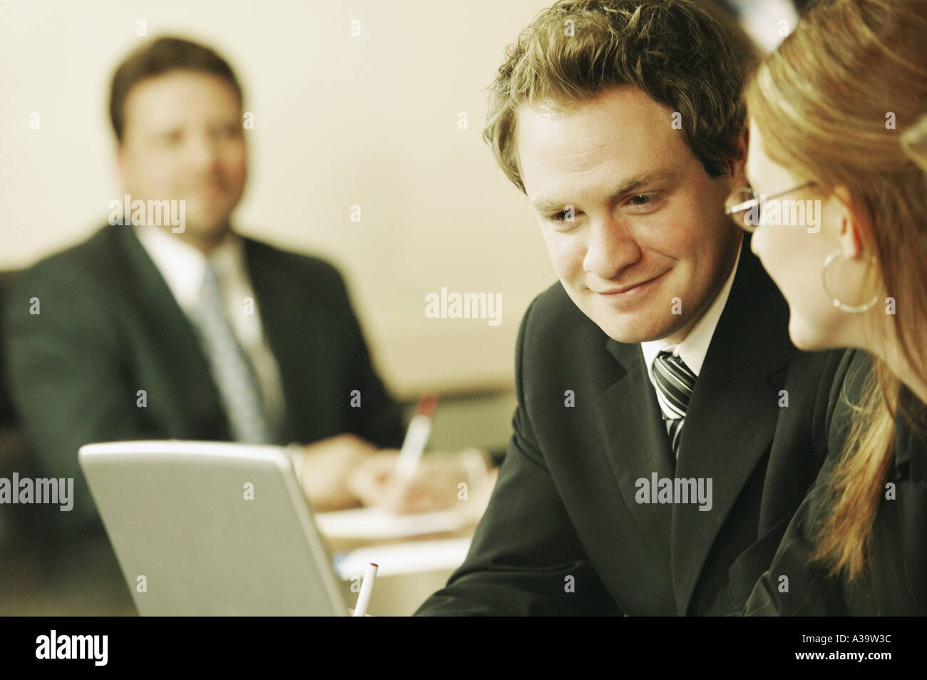 three people at a business meeting Stock Photo - Alamy