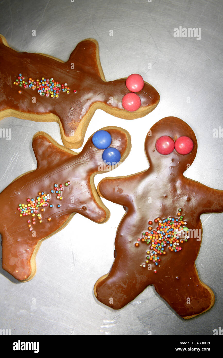 Chocolate coated gingerbread men Stock Photo - Alamy