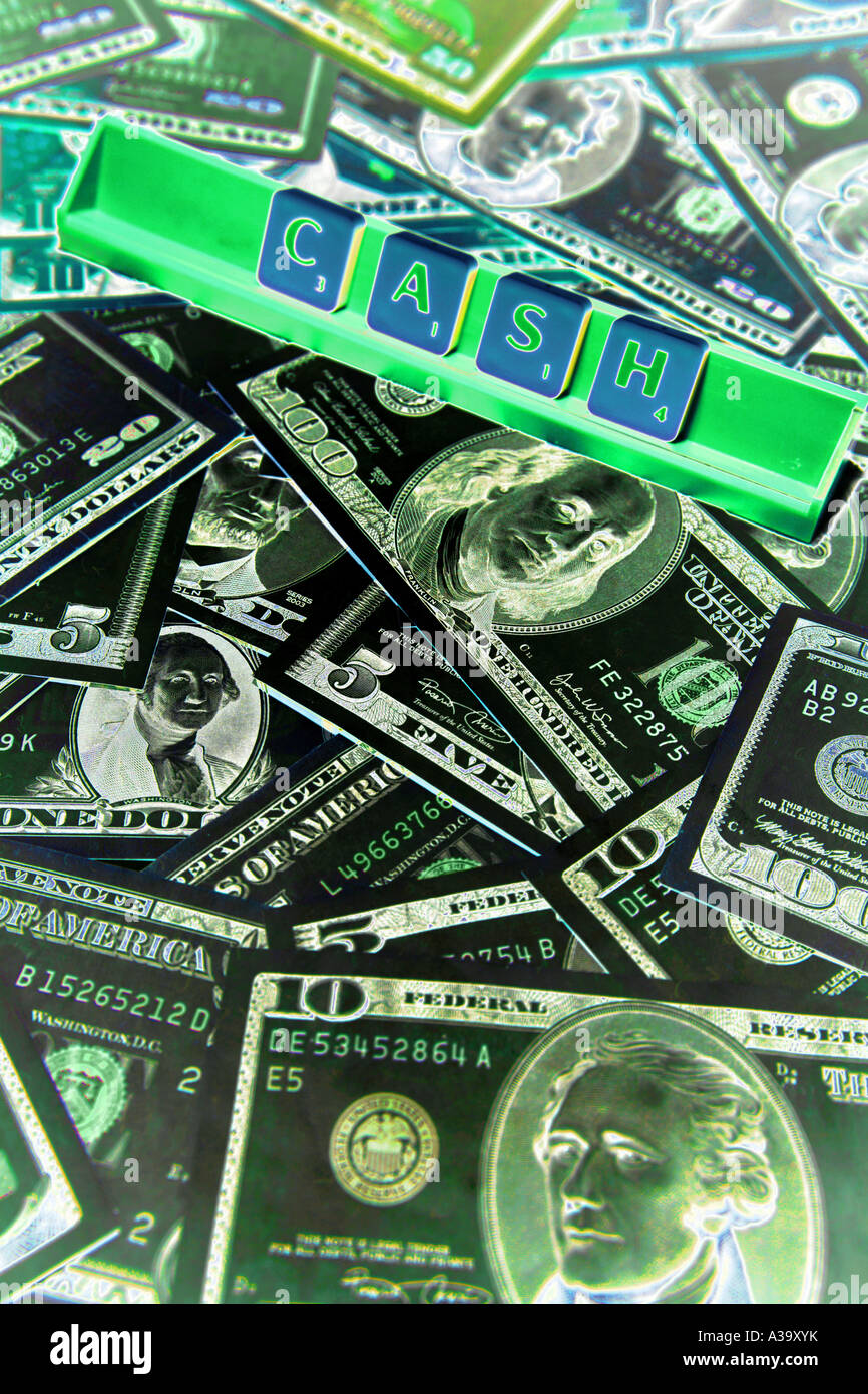 Word cash on top of US paper currency Stock Photo - Alamy
