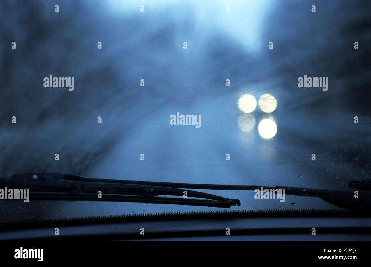 Poor visibility while driving due to lack of water on a dirty window ...