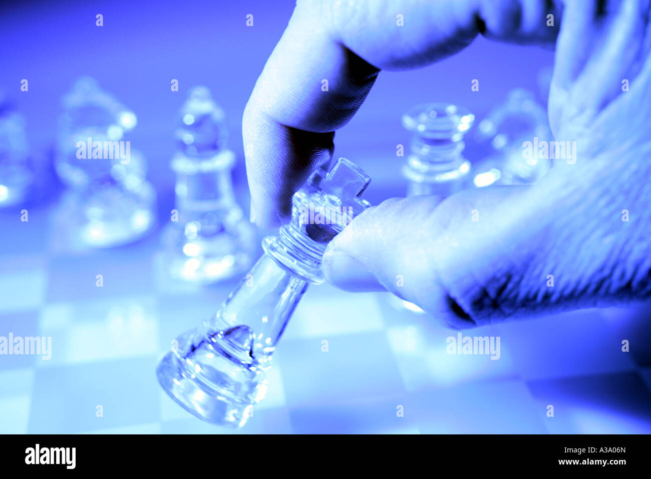 Hand holding chess piece Stock Photo - Alamy