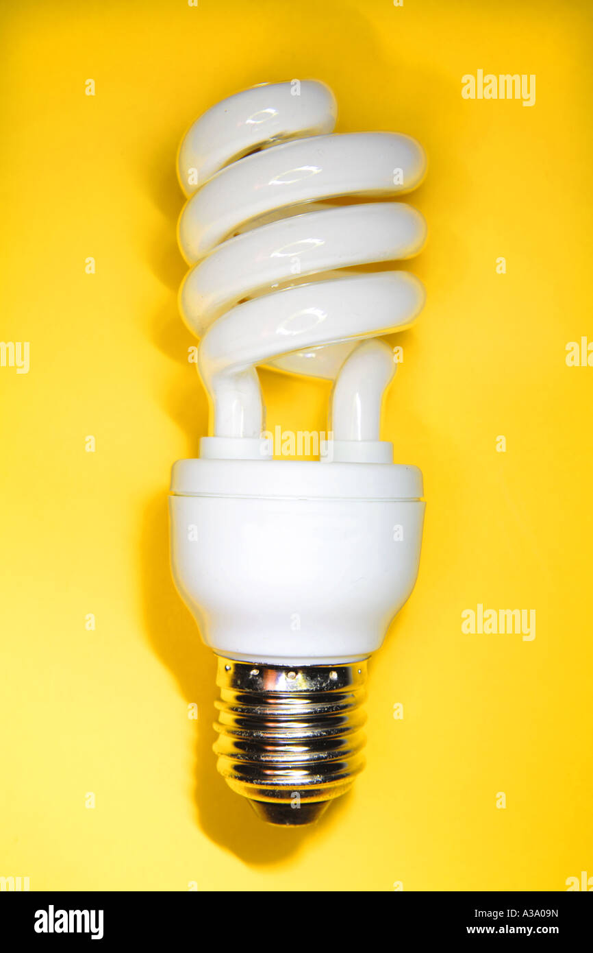 Power saving lightbulb on yellow background Stock Photo - Alamy
