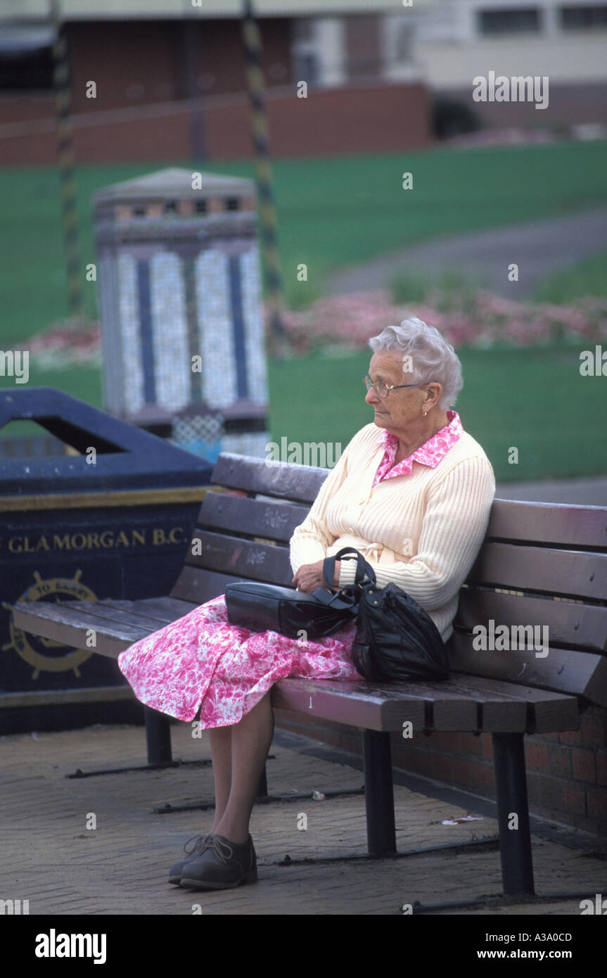 Old lady sat on bench hi-res stock photography and images - Alamy