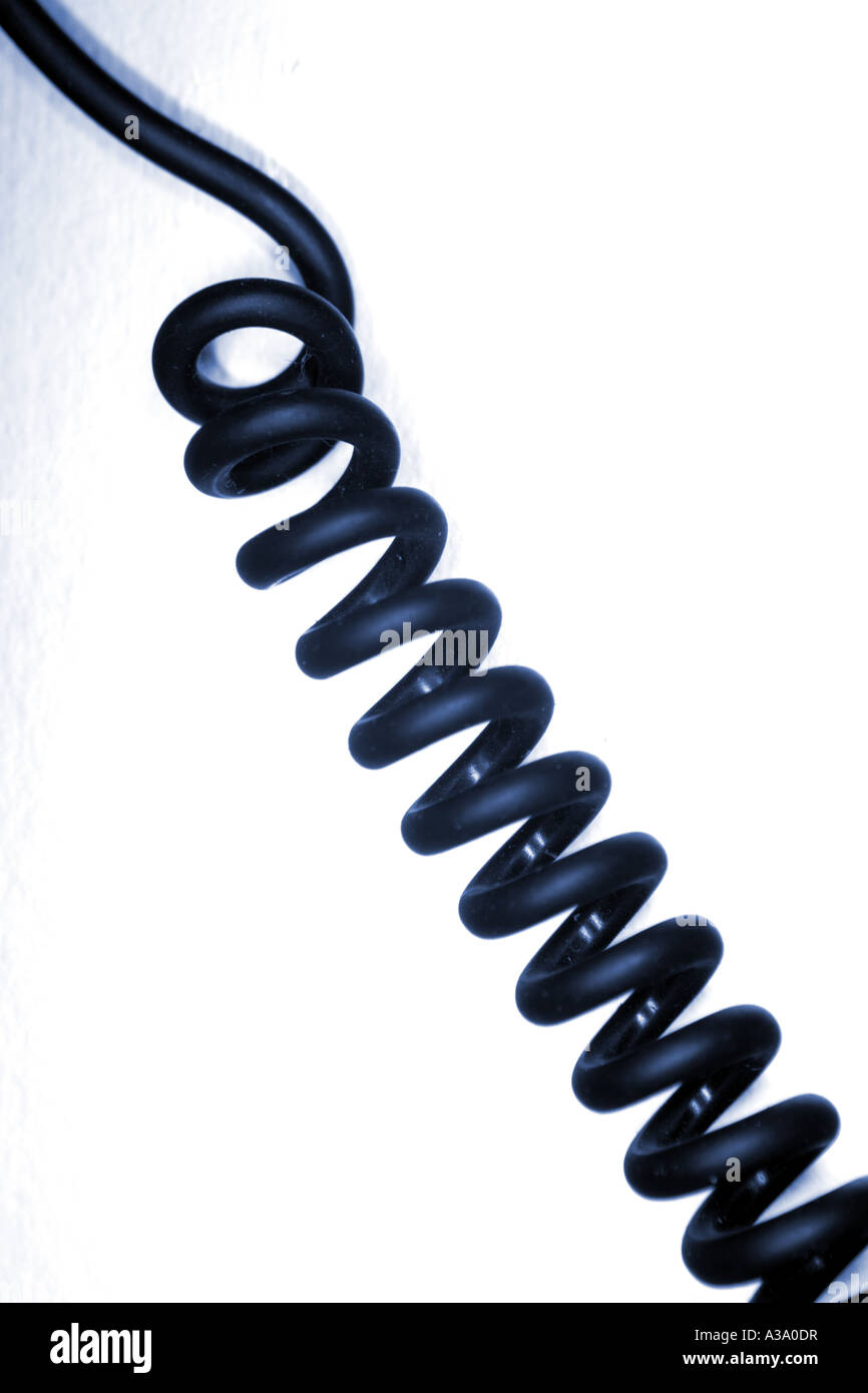 Curly cable on white background Stock Photo - Alamy