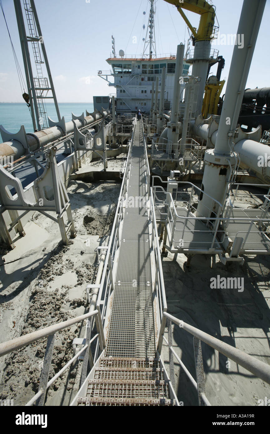 Sand loaded into hopper of a Trailing Suction Hopper Dredger at work ...