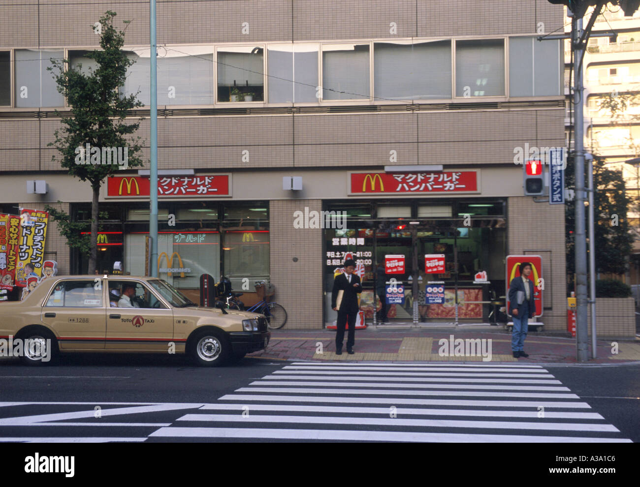 September 2001 Tokyo Japan A Japanese Taxi waits outside a McDonalds ...