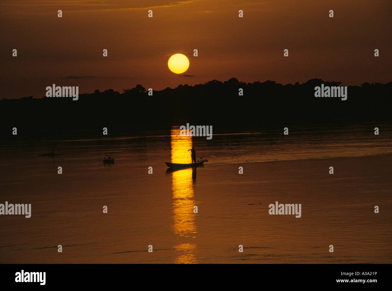 congo river with pirogue sunset Stock Photo - Alamy