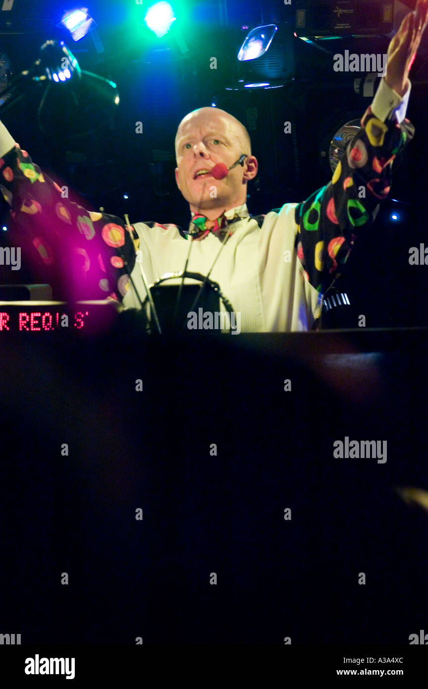 DJ with arms in the air Stock Photo - Alamy