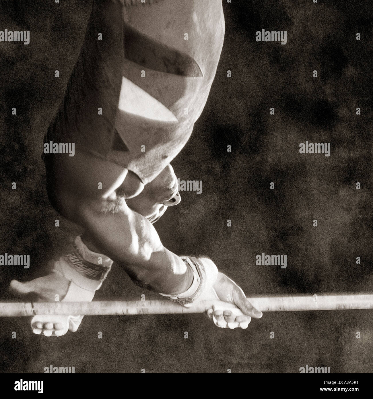 male gymnast hand swap on bar Stock Photo - Alamy