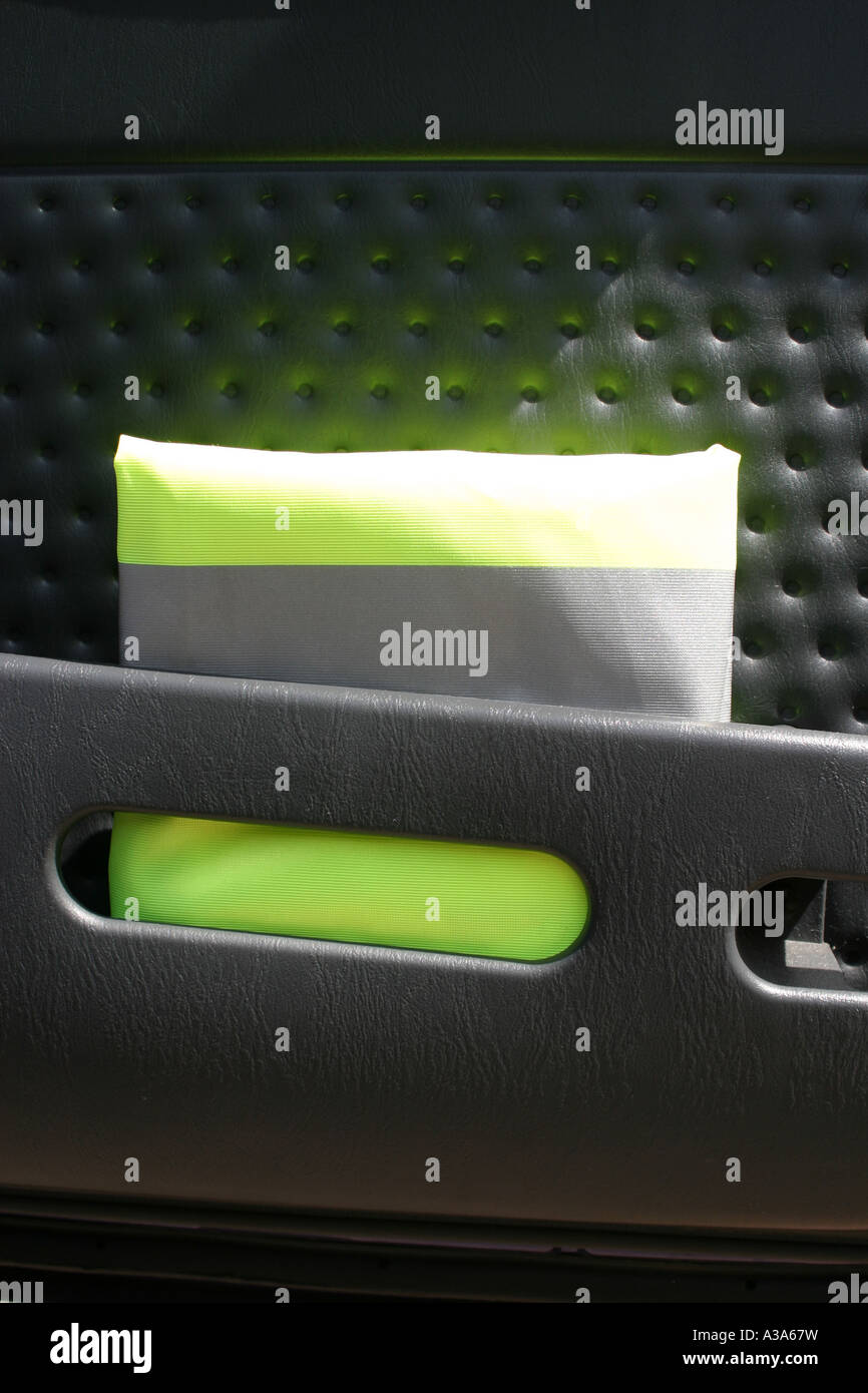 Flourescent jacket in car door pocket Stock Photo - Alamy