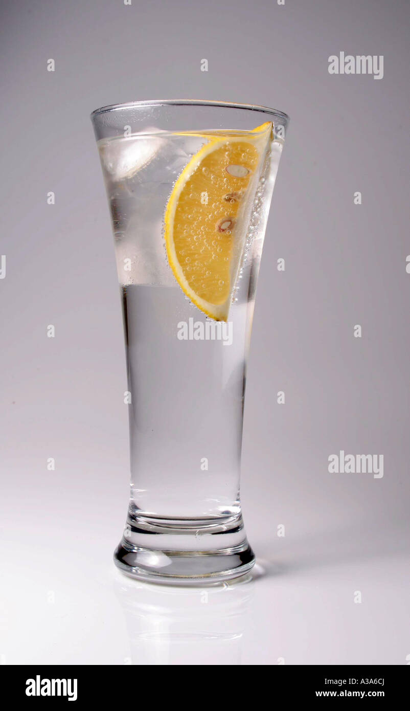 Glass of Gin and Tonic with lemon and ice Stock Photo - Alamy