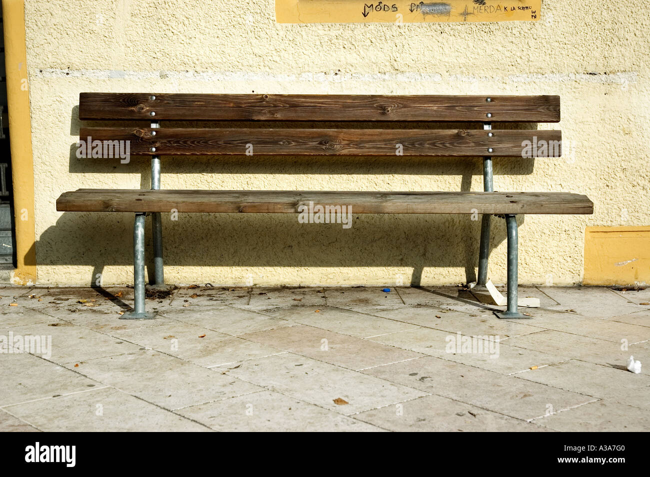 Park bench wall shadow sun sunny italy sacile wall site hi-res stock ...