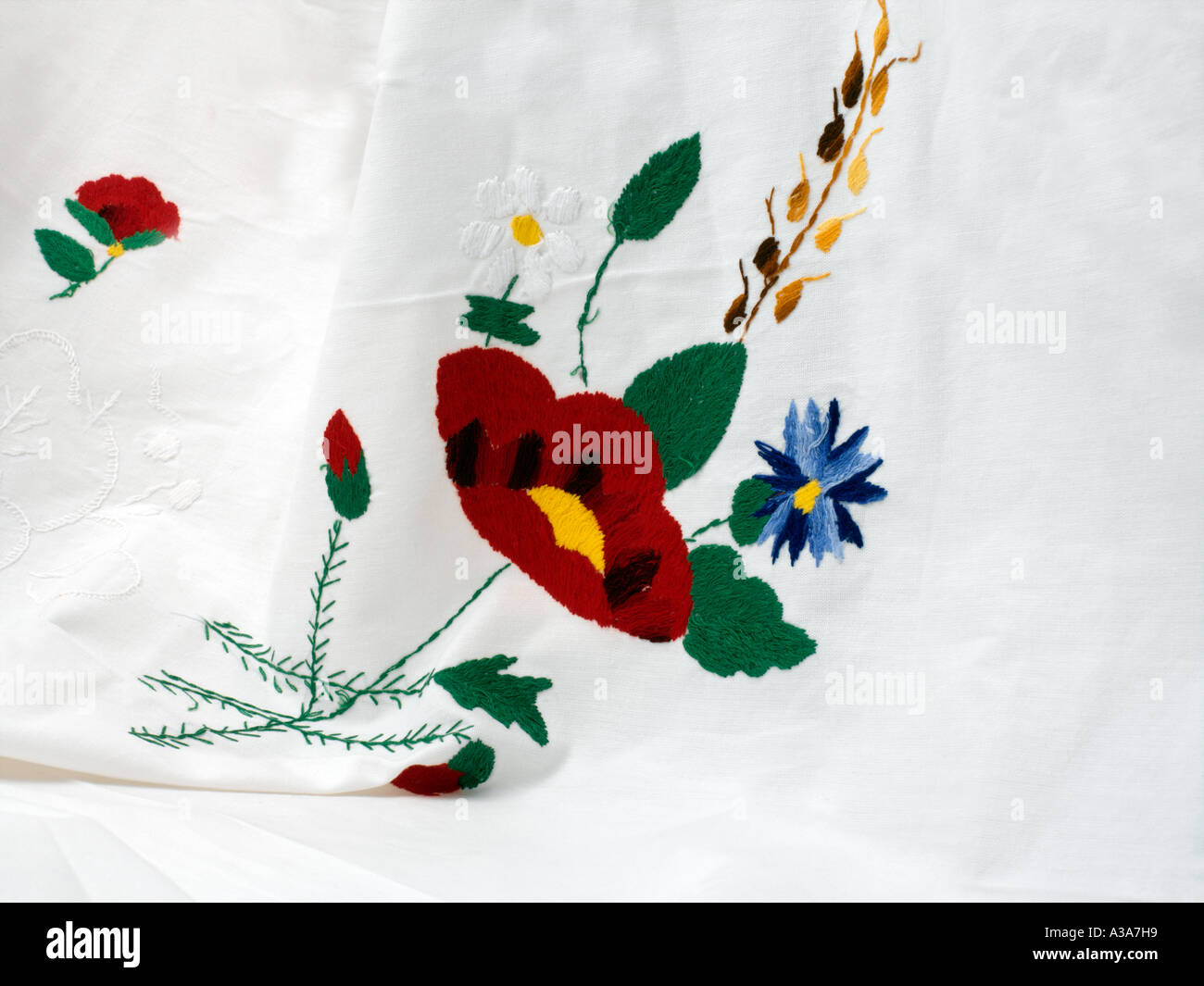 Mauritius Handicrafts Embroidered Flowers on a White Tablecloth Stock ...