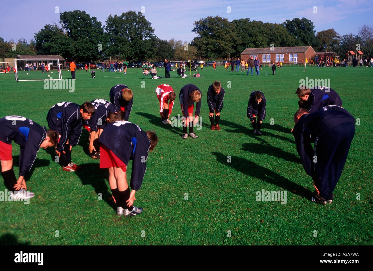 Boys' football team warming up before a match Stock Photo - Alamy
