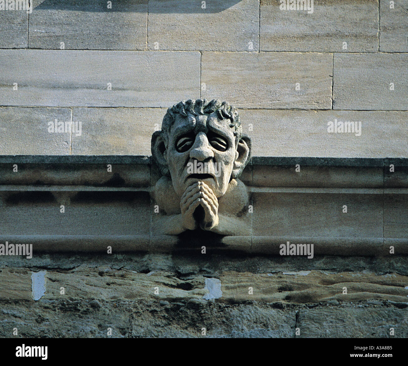 Gargoyle stone carved head grotesque Stock Photo - Alamy