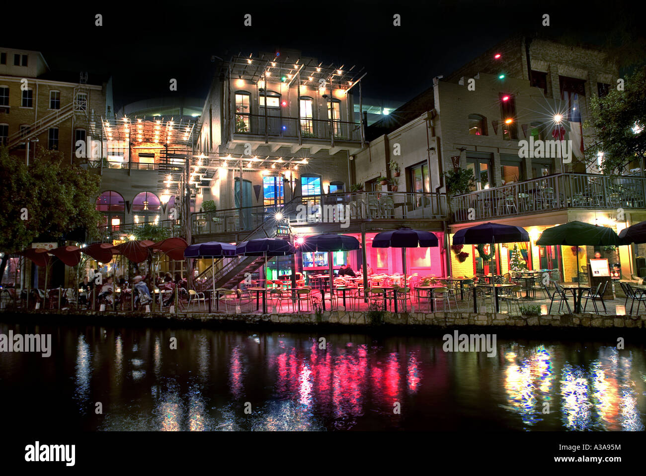 San Antonio Texas river walk at night with Christmas lights reflecting ...