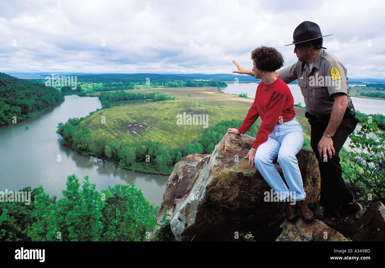 A park ranger shows a young woman a scenic view of the Arkansas River ...