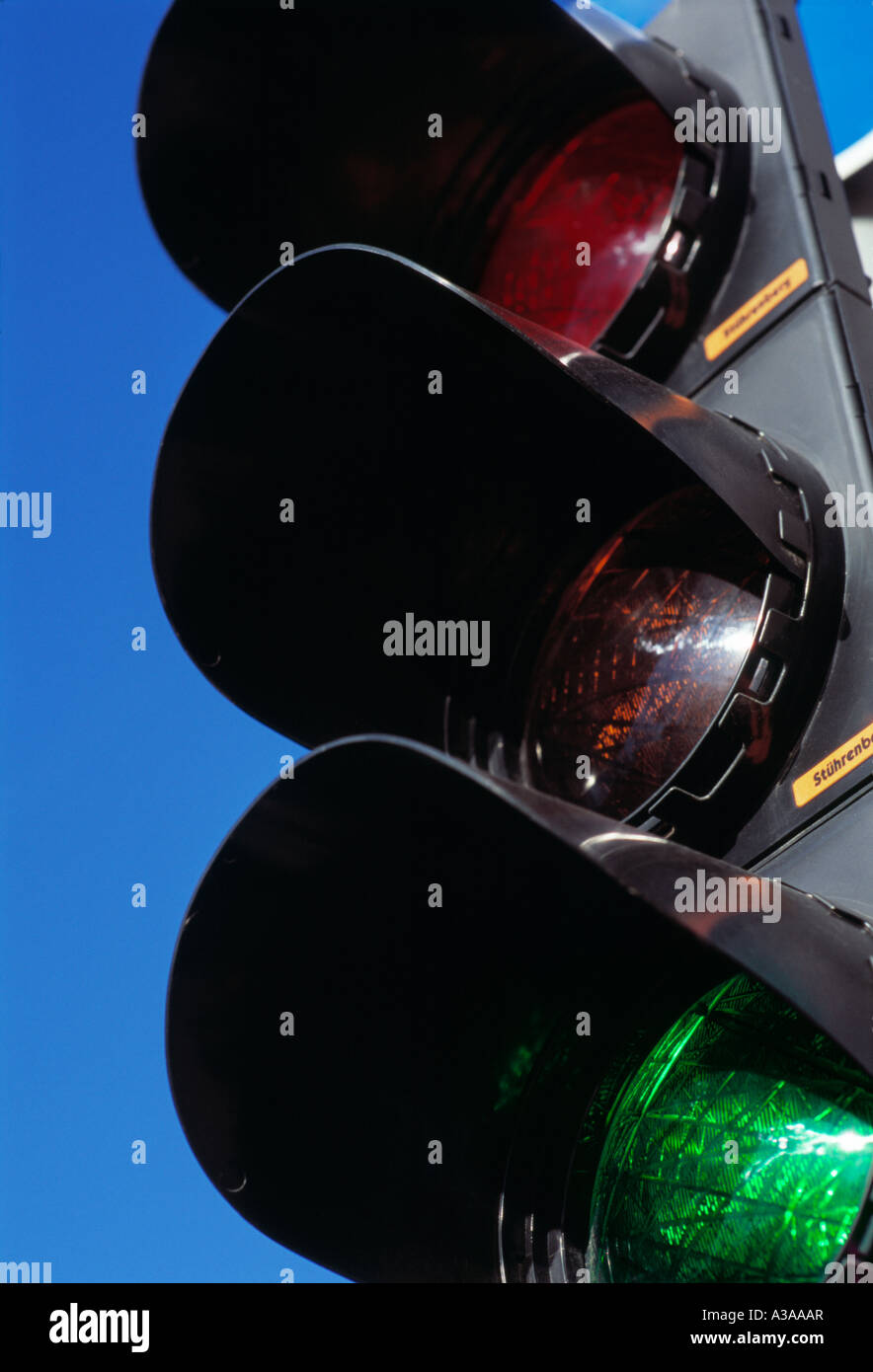 Traffic lights from below with green go light illuminated Stock Photo ...